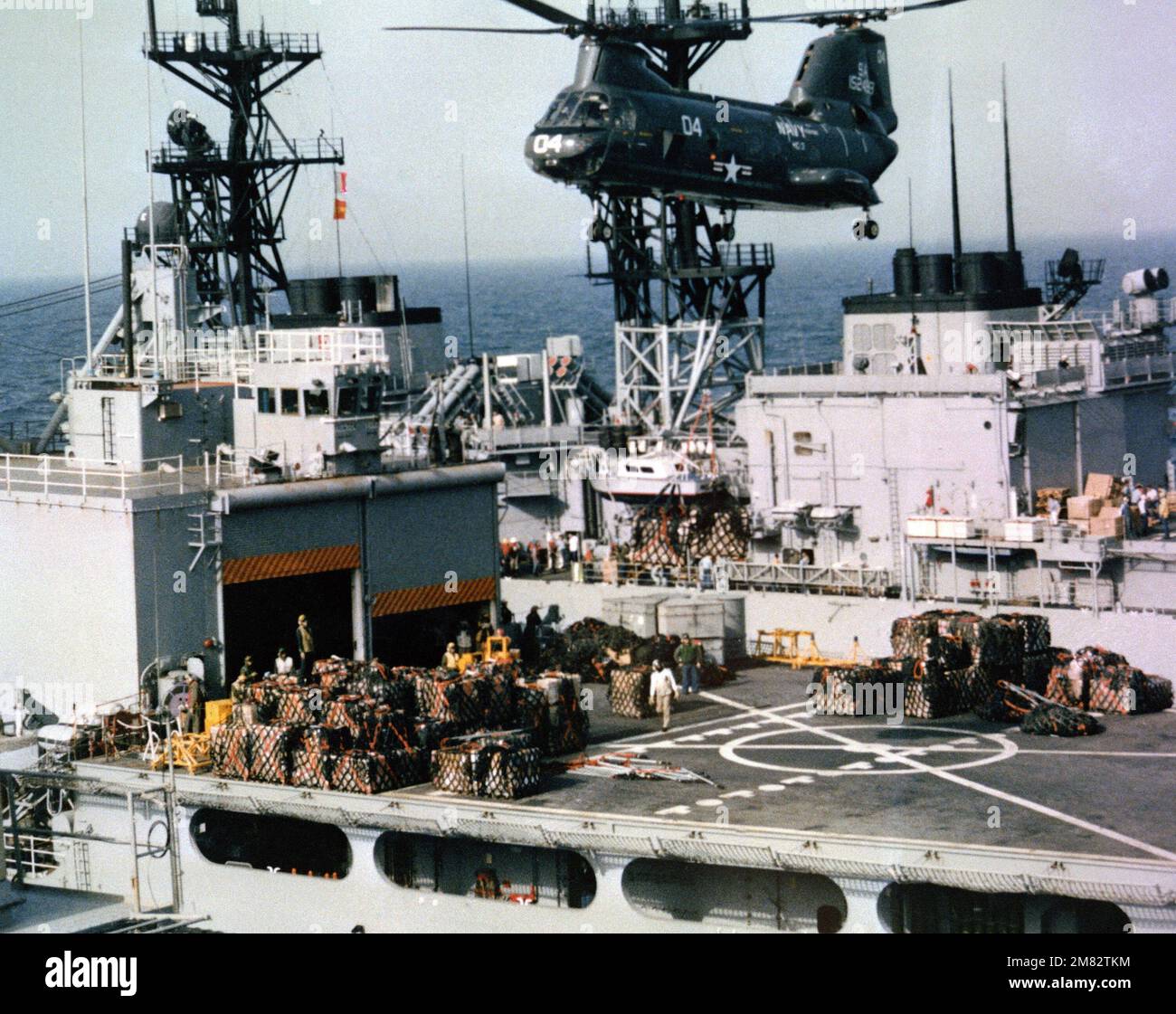 Left front view of a CH-46 Sea Knight helicopter as it is used to lift ...