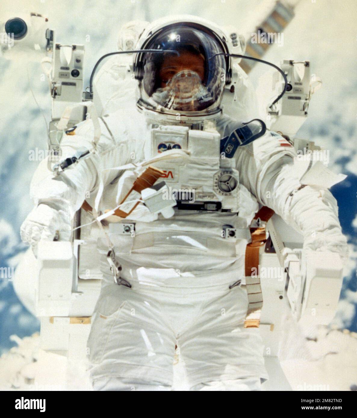 A front view of an astronaut using his rocket pack to control his ...