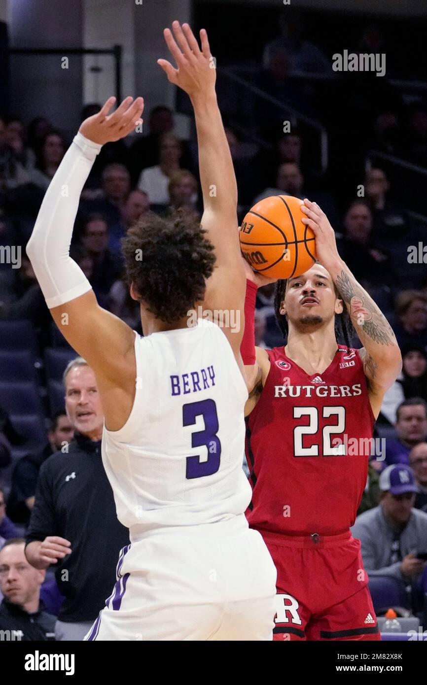 Rutgers guard Caleb McConnell, right, shoots against Northwestern guard ...
