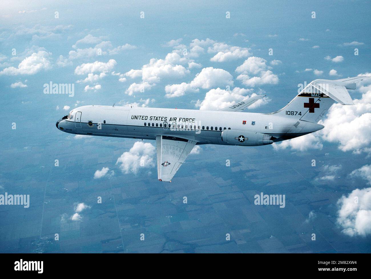 An air-to-air left side view of a 375th Aeromedical Airlift Wing C-9 ...