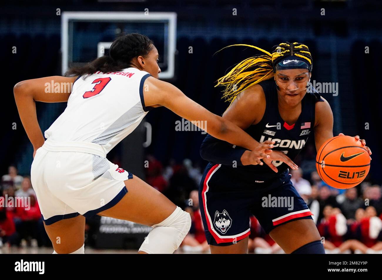 Connecticut's Aaliyah Edwards, right, drives past St. John's Danielle ...