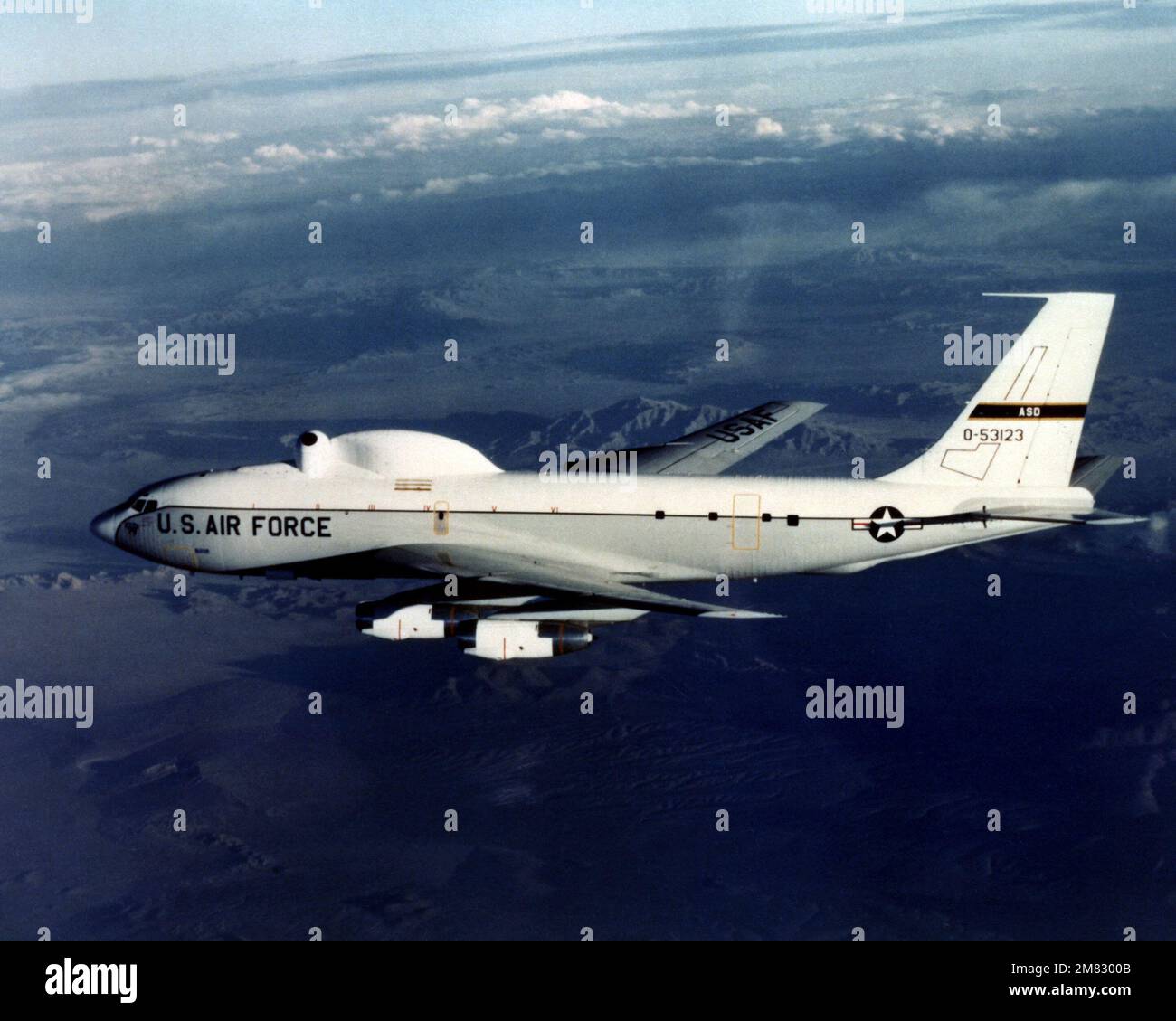 An air-to-air left side view of an NKC-135 Airborne Laser Laboratory ...