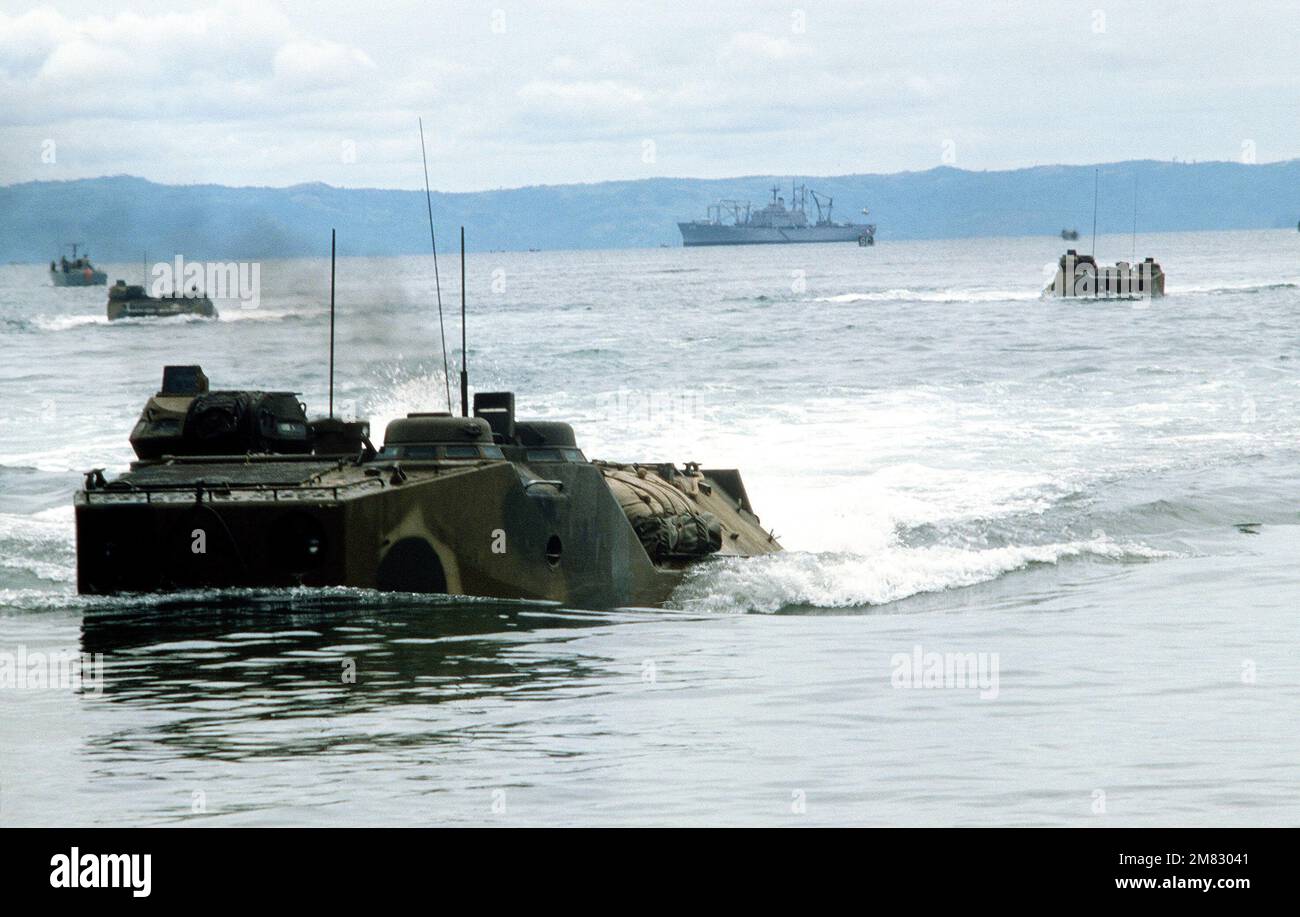 Marine Corps personnel tracked landing vehicles (LVTP7) approach Red ...