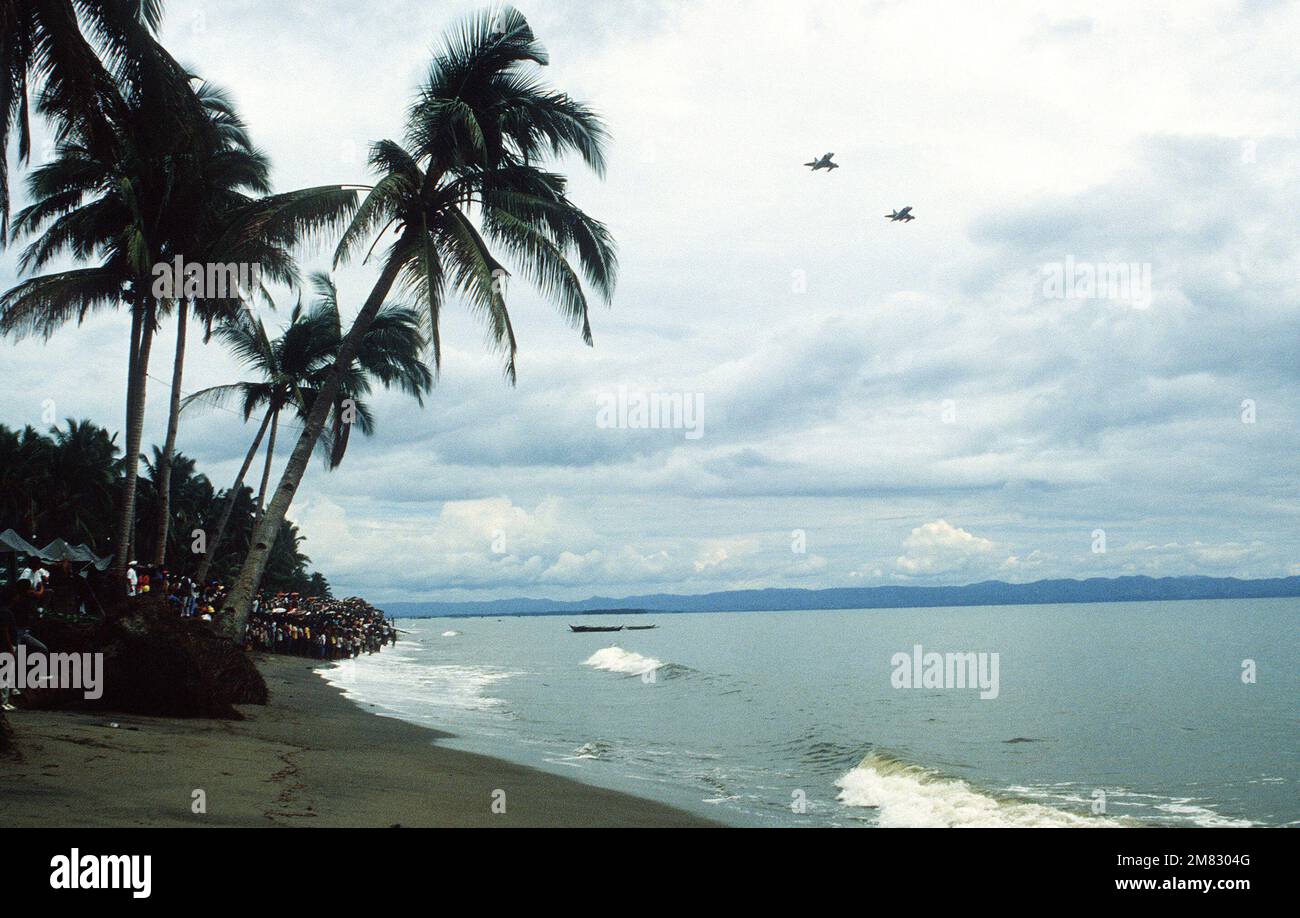 Two Navy A-4 Skyhawk aircraft fly over on a simulated bombing run ...