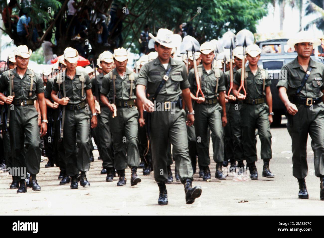 Philippine military personnel march in a parade after participating in ...