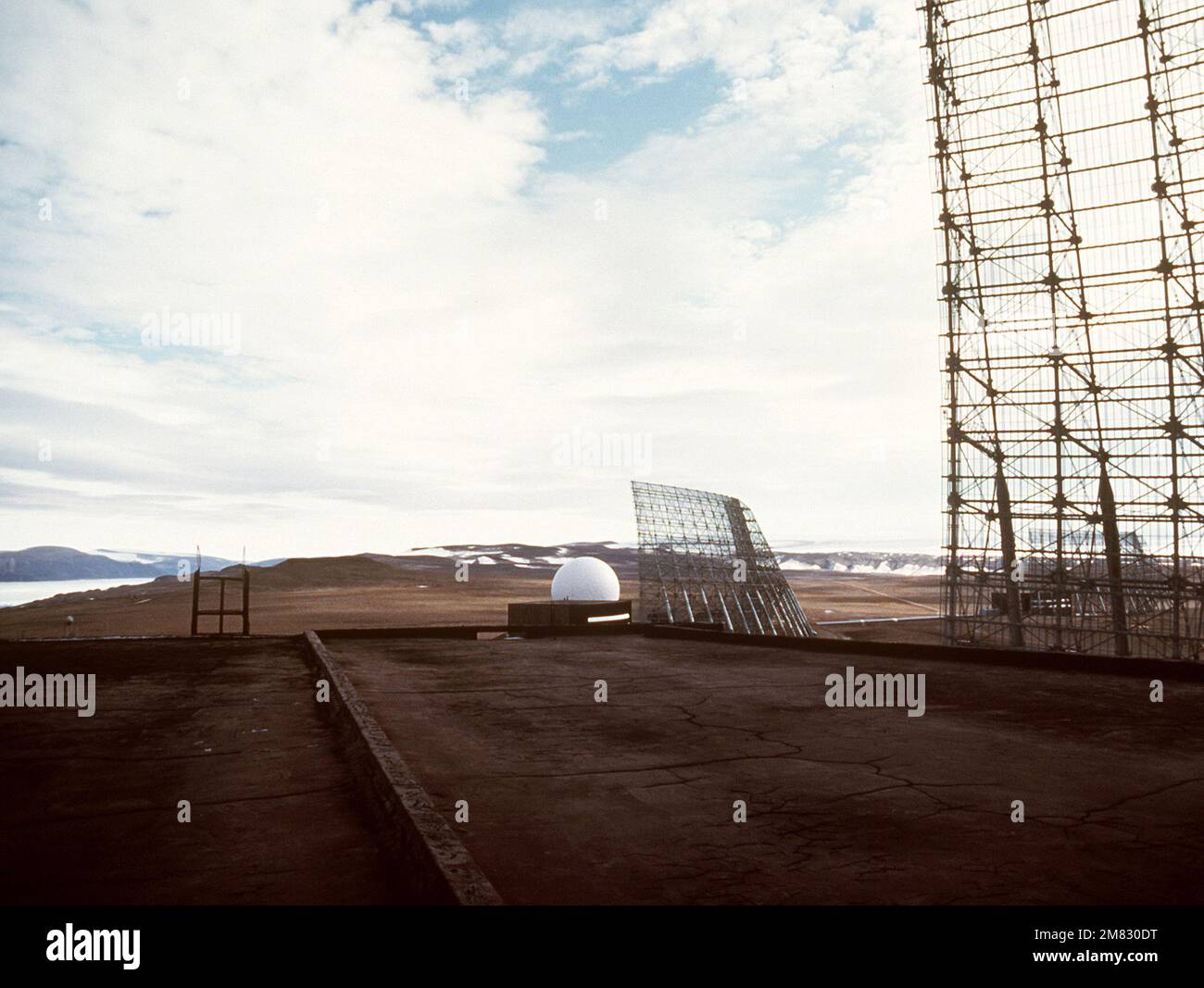 A view of three AN/FPS-50 early warning radar antennas and an antenna ...