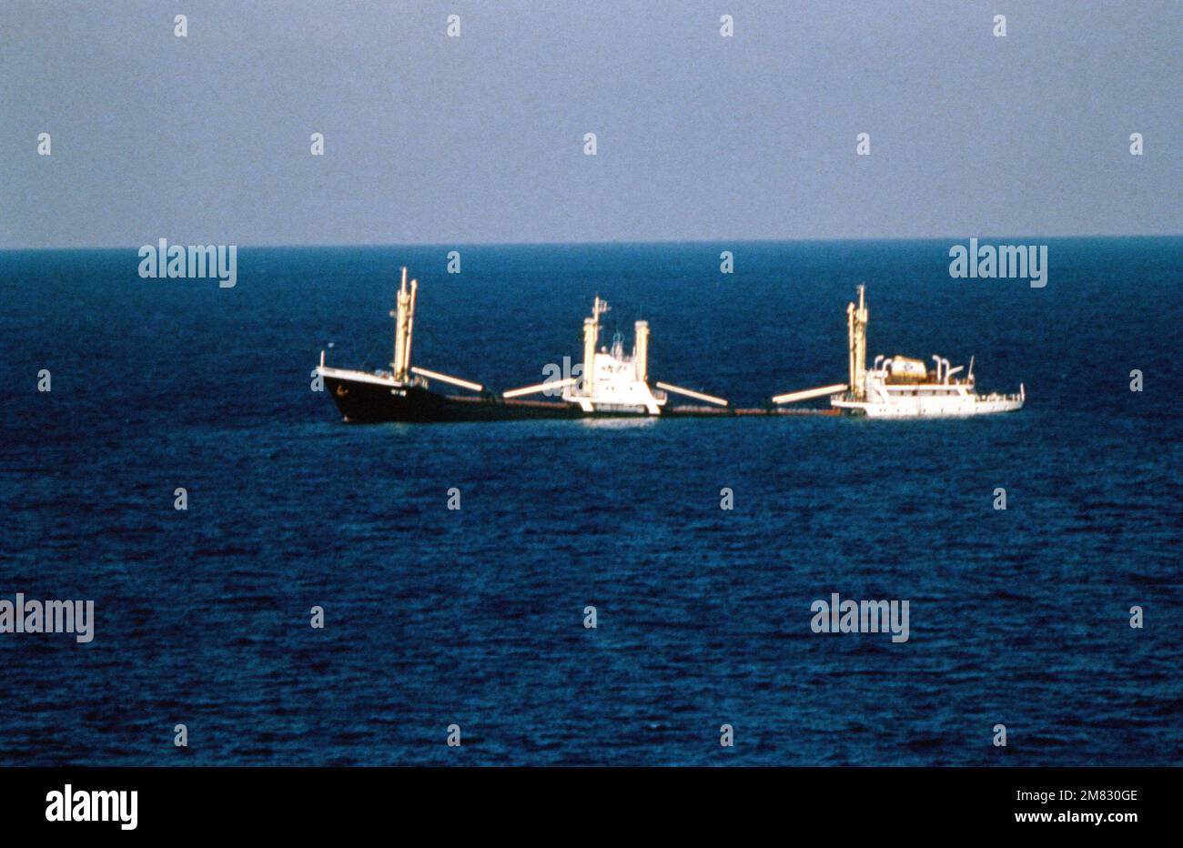 A port side view of the sinking Panamanian ship "SKY ONE". The tank ...