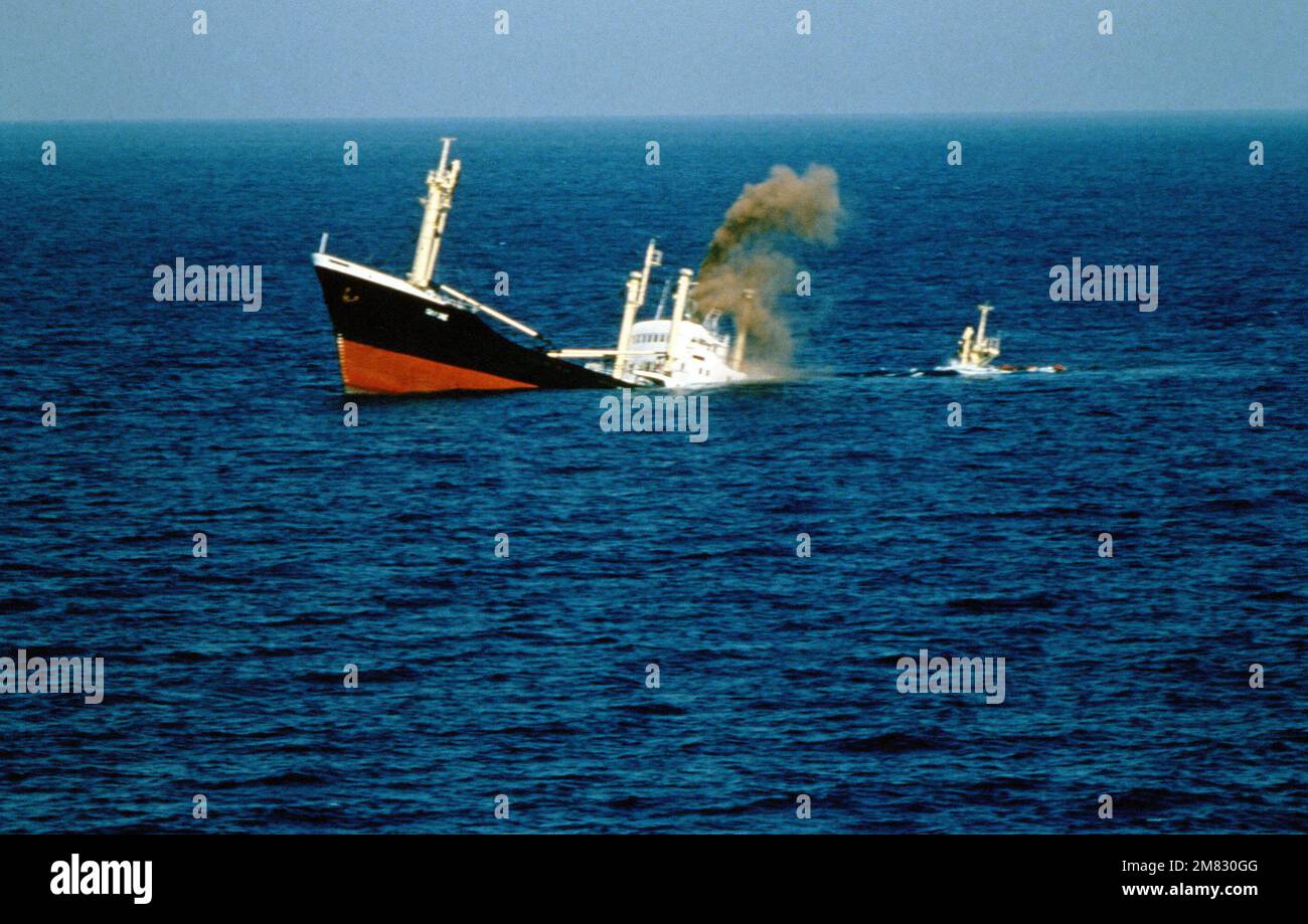 A port side view of the sinking Panamanian ship "SKY ONE". The tank ...