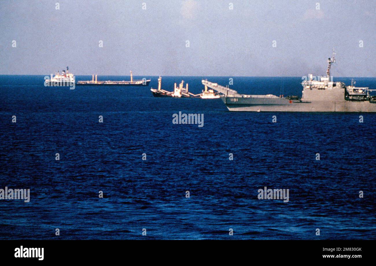 The tank landing ship USS SUMTER (LST 1181) is utilized to assist in ...