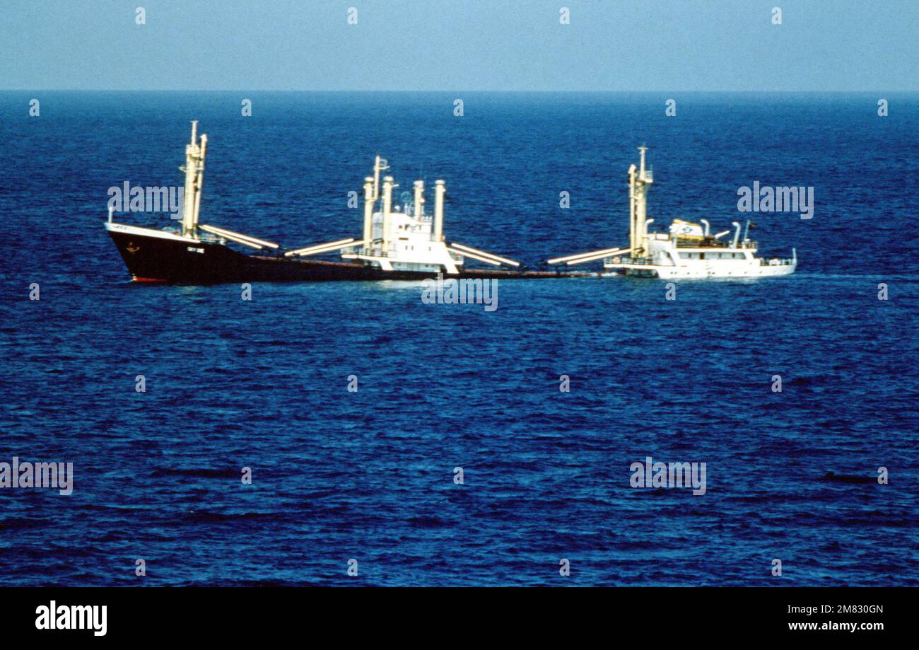 A port side view of the sinking Panamanian ship "SKY ONE". The tank ...