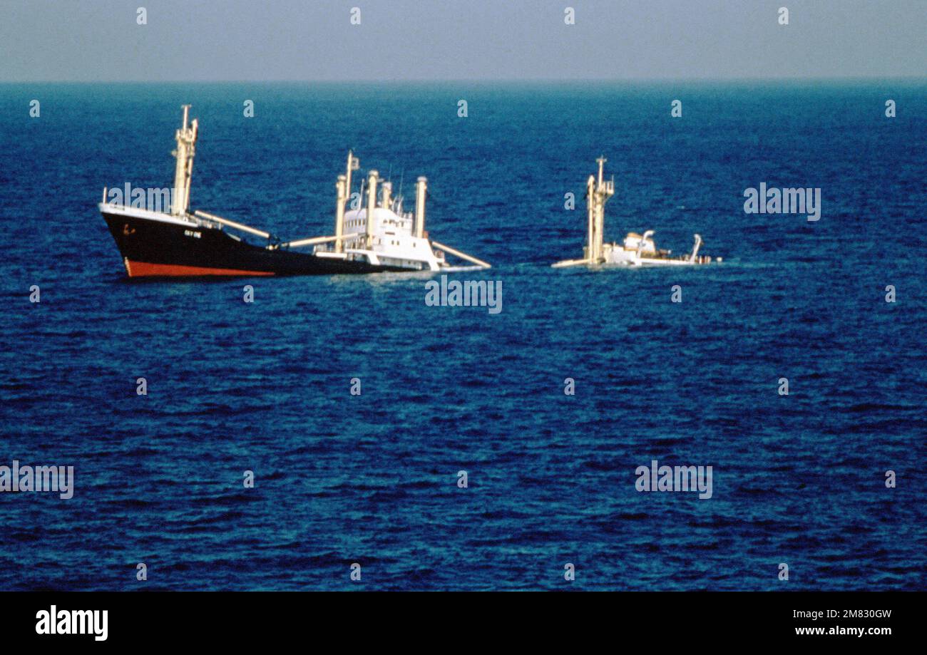 A port side view of the sinking Panamanian ship "SKY ONE". The tank ...