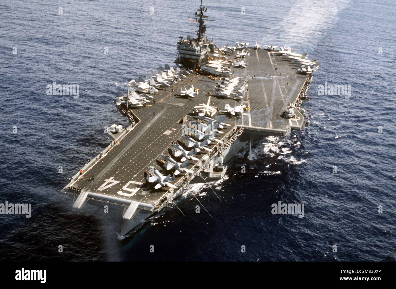 An elevated port bow view of the aircraft carrier USS CONSTELLATION (CV ...