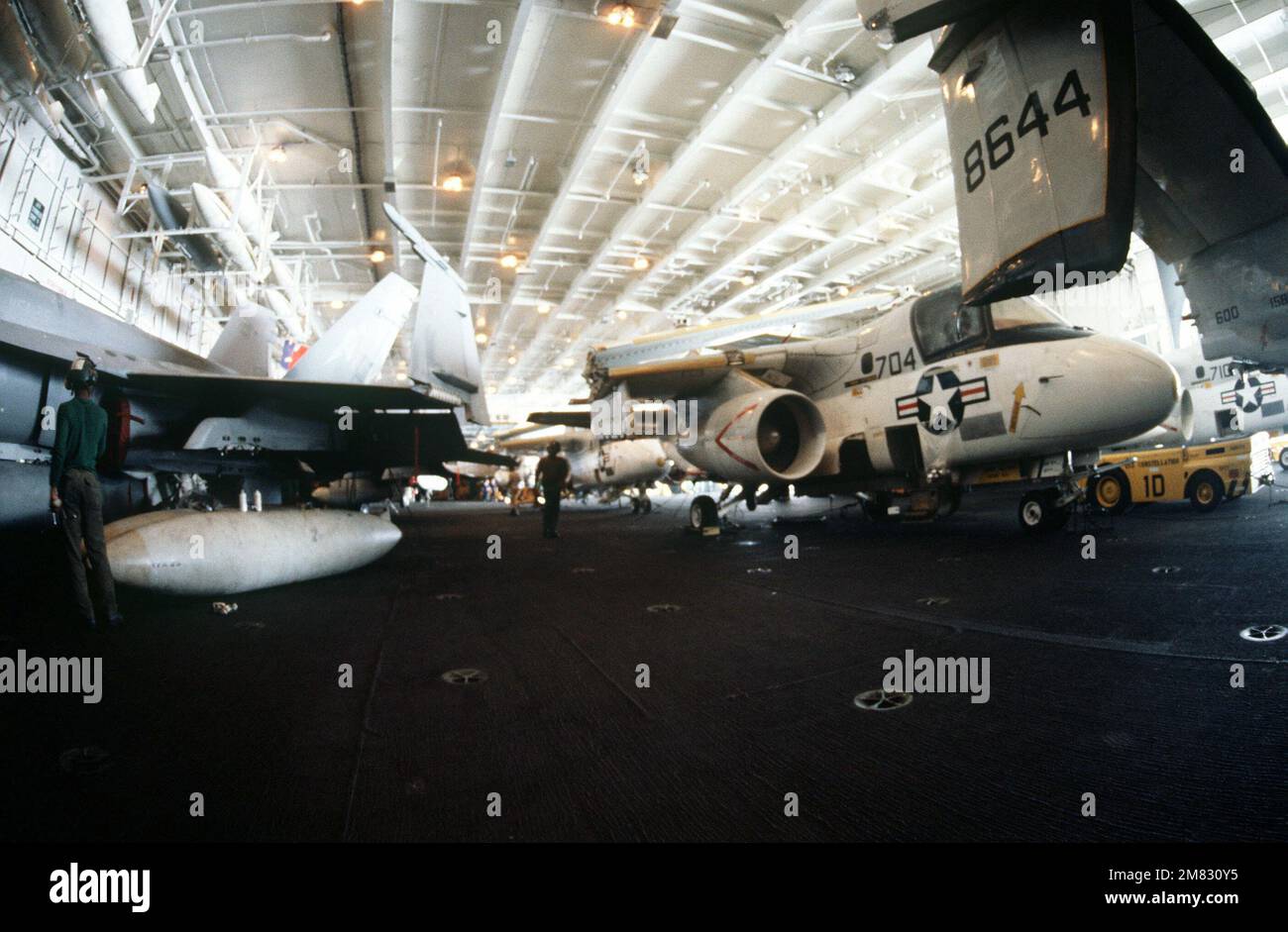 An F/A-18A Hornet aircraft from Strike Fighter Squadron 25 (left) and ...