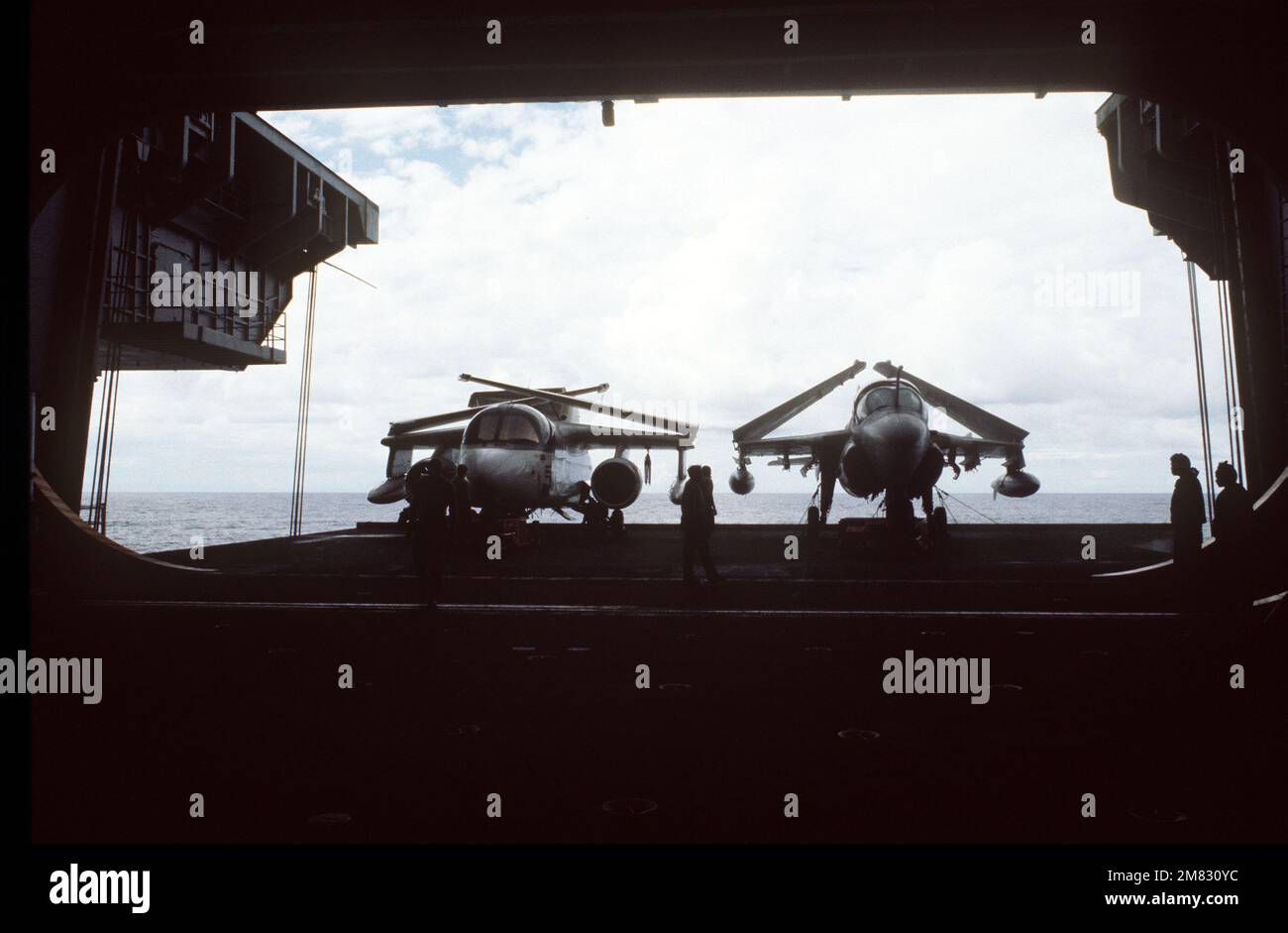 An S-3A Viking aircraft (left) and A-6E Intruder aircraft are parked on ...