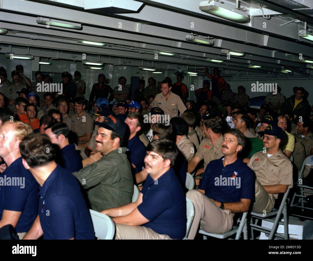 Members of Carrier Air Wing 15 watch a variety show aboard the nuclear ...