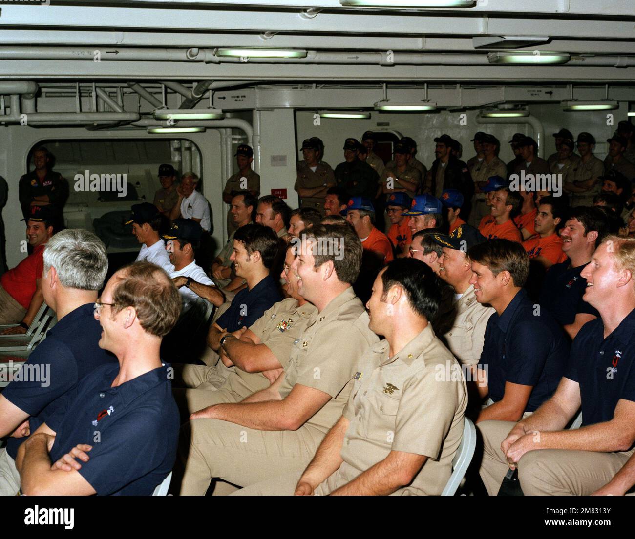 Members of Carrier Air Wing 15 watch a variety show aboard the nuclear ...
