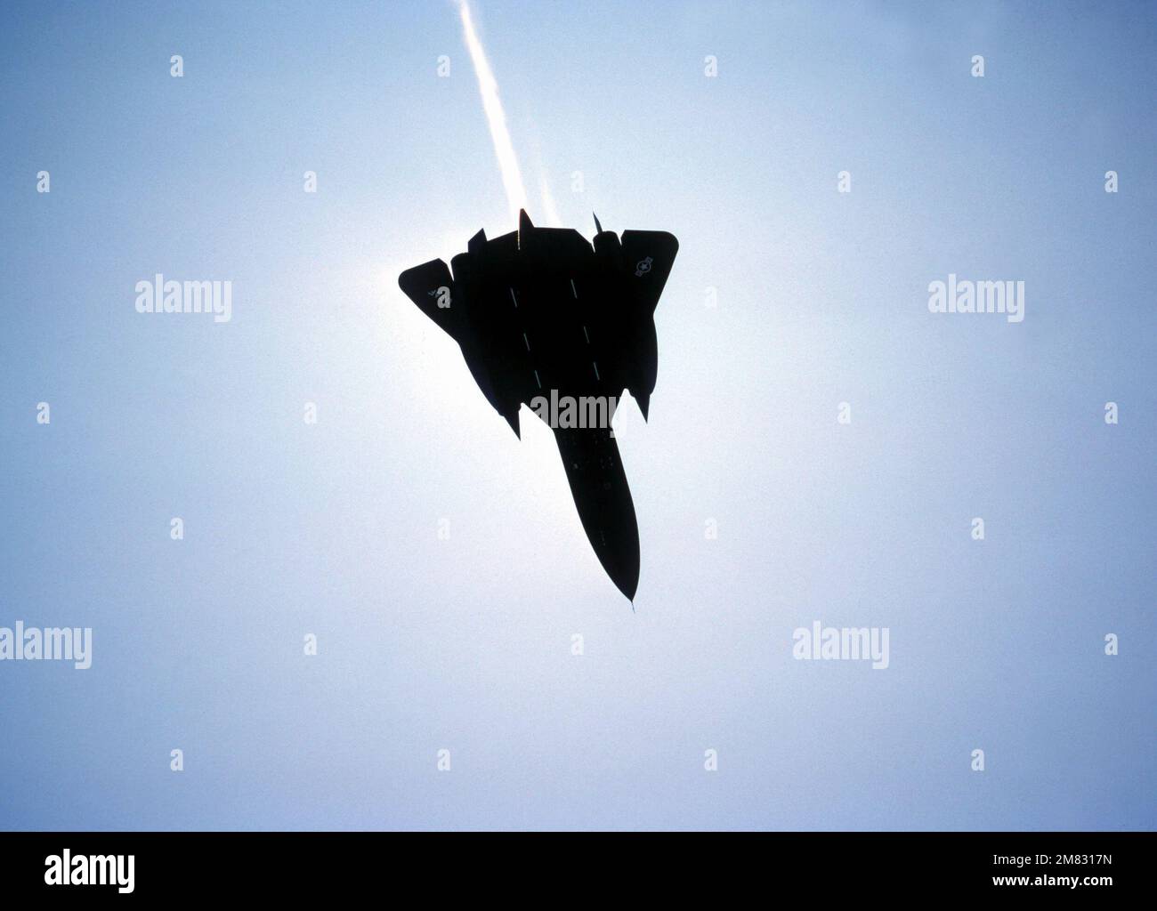 An SR-71 Black Bird reconnaissance aircraft, with afterburner on, flies ...