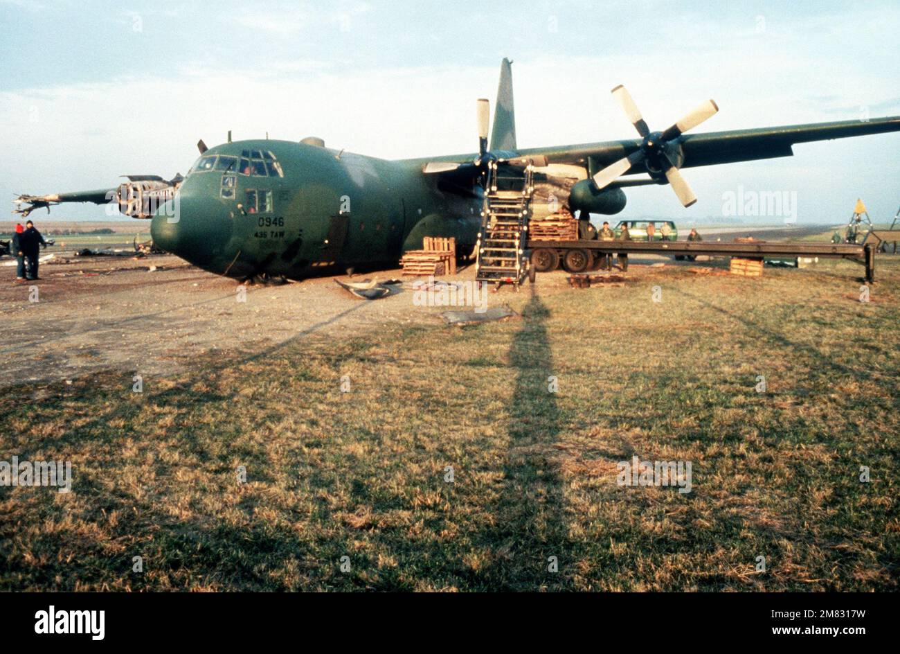 After a crash landing a 37th Tactical Airlift Squadron C-130E sits off ...
