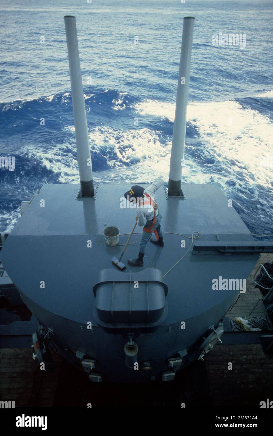 GUNNER's Mate (Guns) SEAMAN Timothy Youell scrubs the build up of salt ...