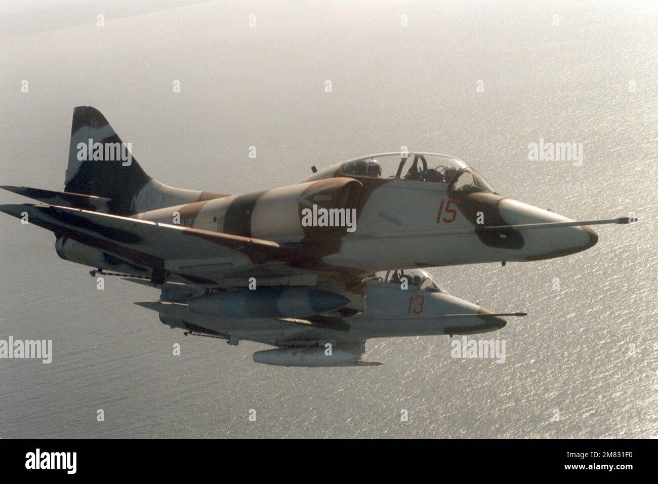 A right side view of two TA-4 Skyhawk aircraft in-flight. Country ...