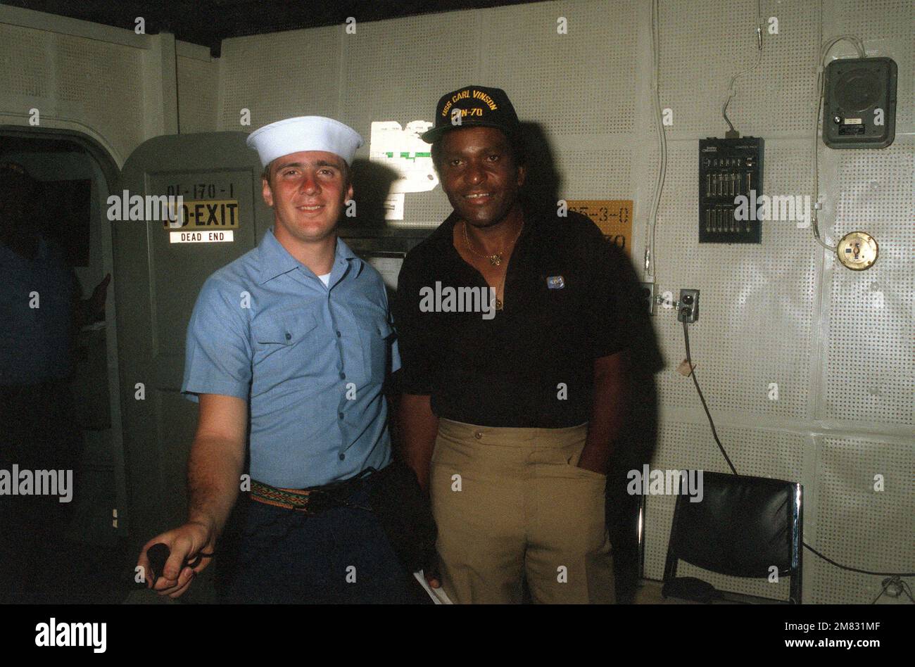 Country singer Charlie Pride poses with a crewman during his visit ...