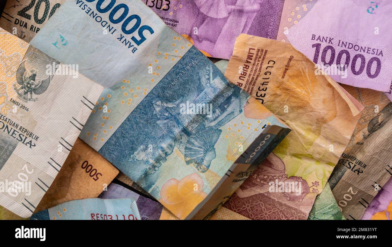 pile of rupiah banknotes as background Stock Photo - Alamy