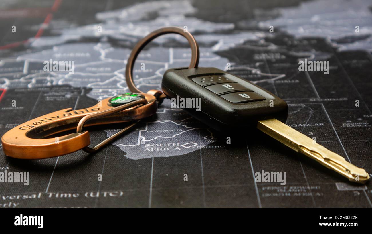 black car key over black map Stock Photo - Alamy