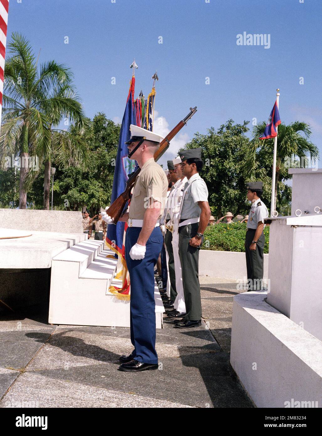 A joint services honor guard participates in a Veteran's Day memorial ...