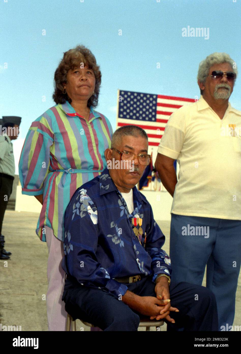 Mrs. Borja stands behind her husband, Vincente Borja, a disabled World ...