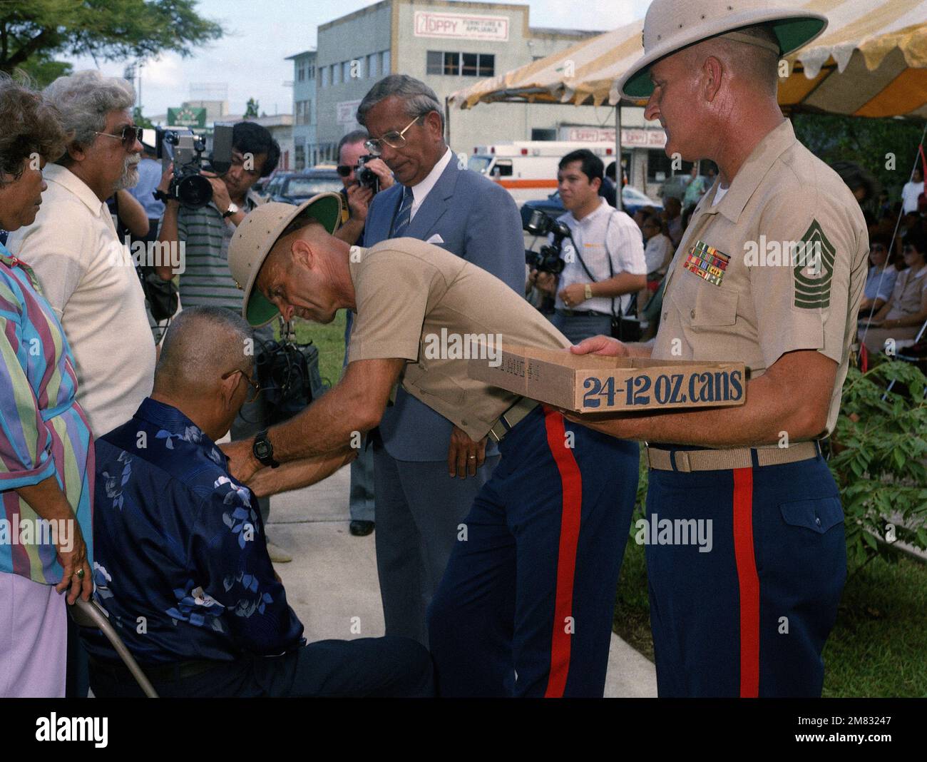 Governor Ricardo J. Bordallo of Guam watches as Colonel J. Karl Miller ...