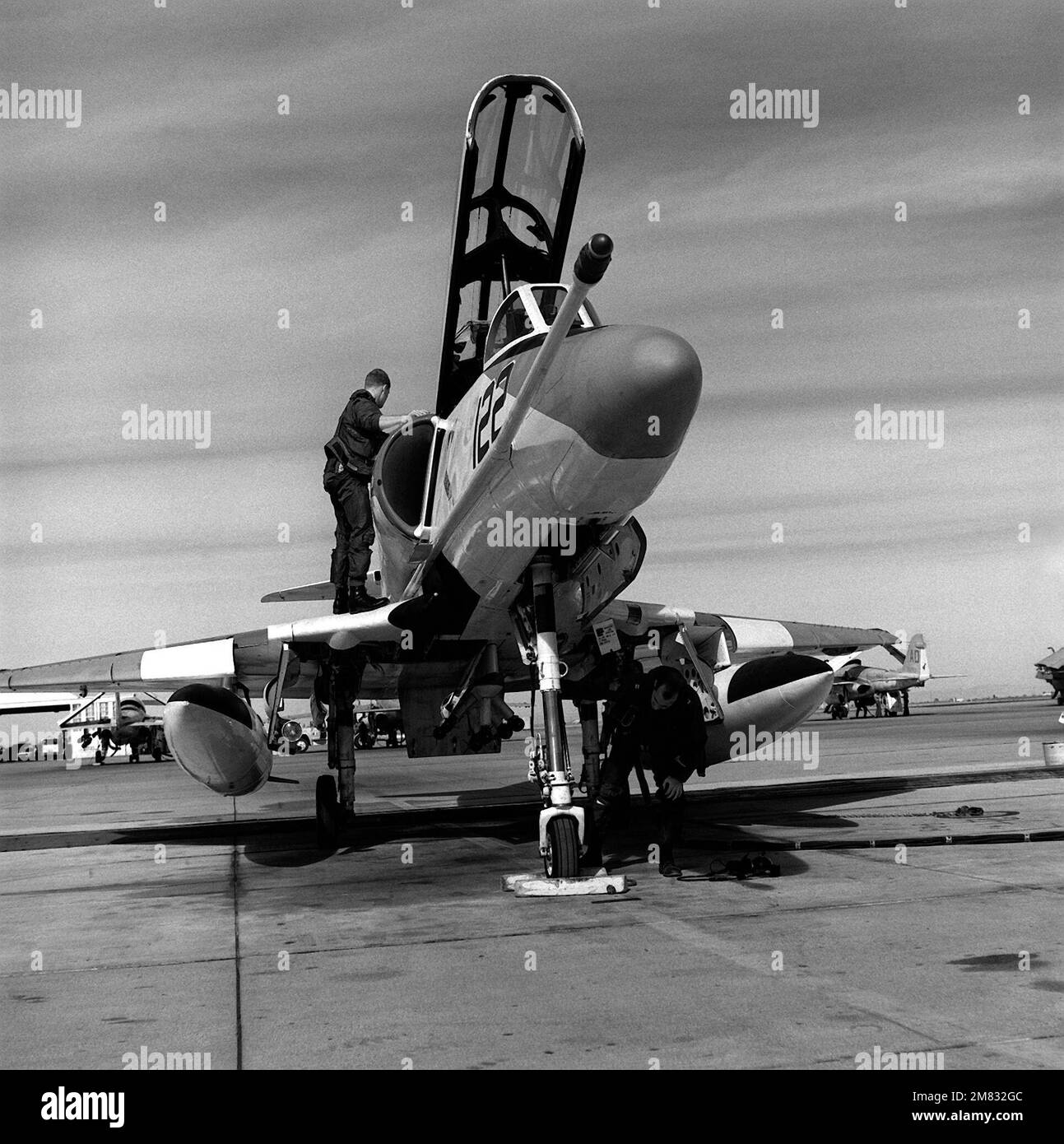 A student pilot and an instructor perform a preflight check on a TA-4J ...