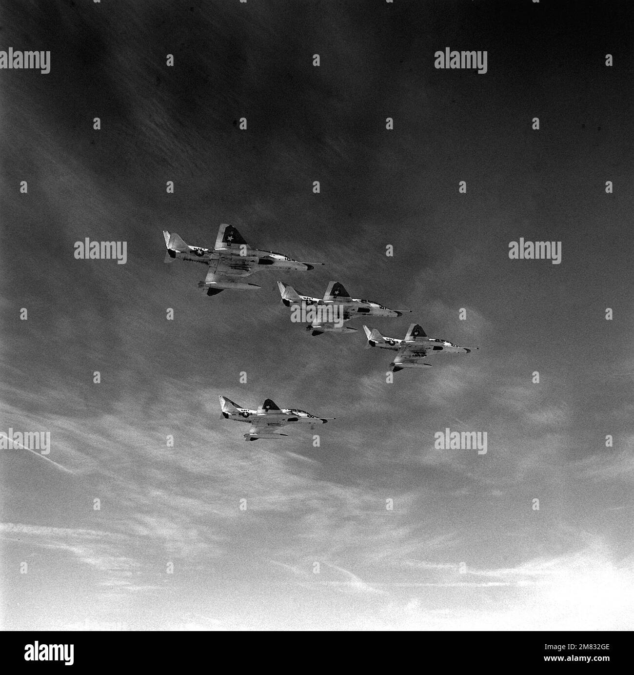 An underside air-to-air view of four TA-4J Skyhawk aircraft of Training ...