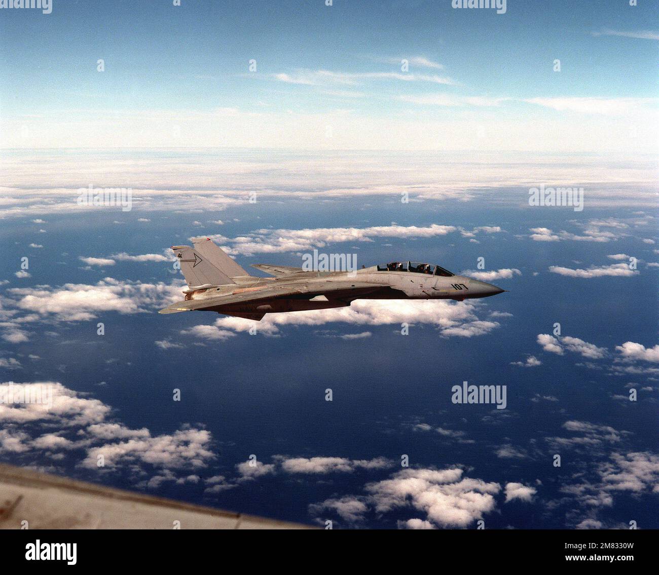 An air-to-air right side view of an F-14A Tomcat aircraft from Naval ...