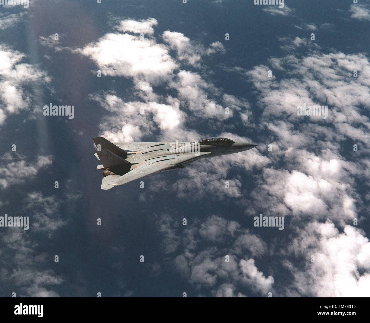 An air-to-air right side view of an F-14A Tomcat aircraft from Naval ...