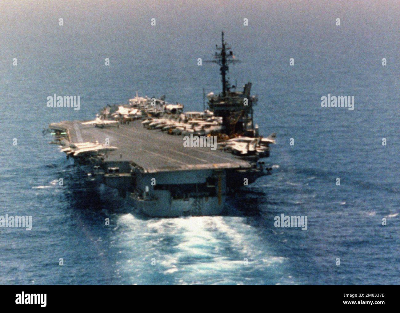 Aerial stern view of the aircraft carrier USS KITTY HAWK (CV 63 ...