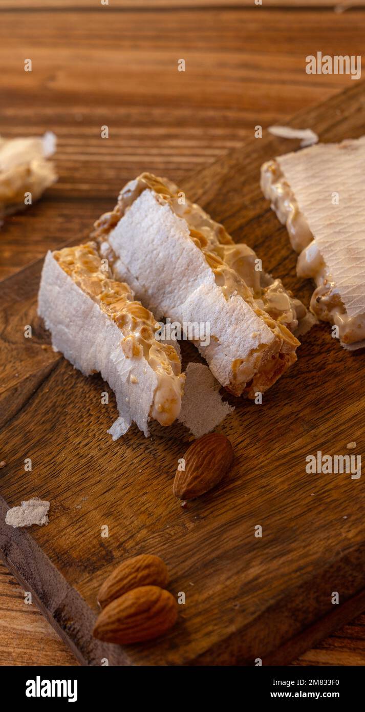 Almond turron dessert slices on wooden desk Stock Photo - Alamy