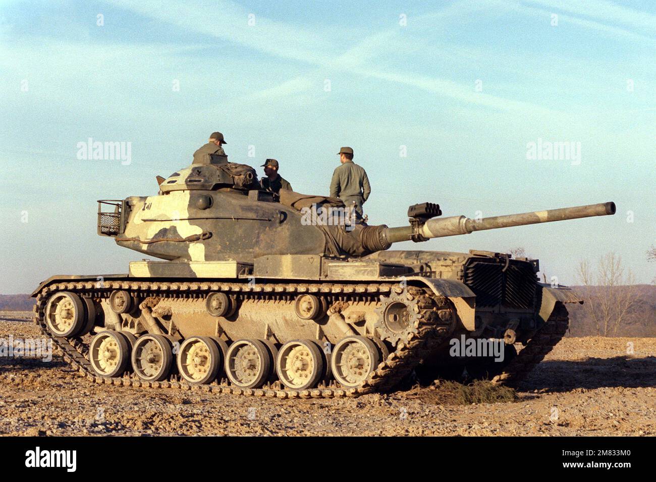 A left rear view of an M-60 main battle tank with the turret traversed ...