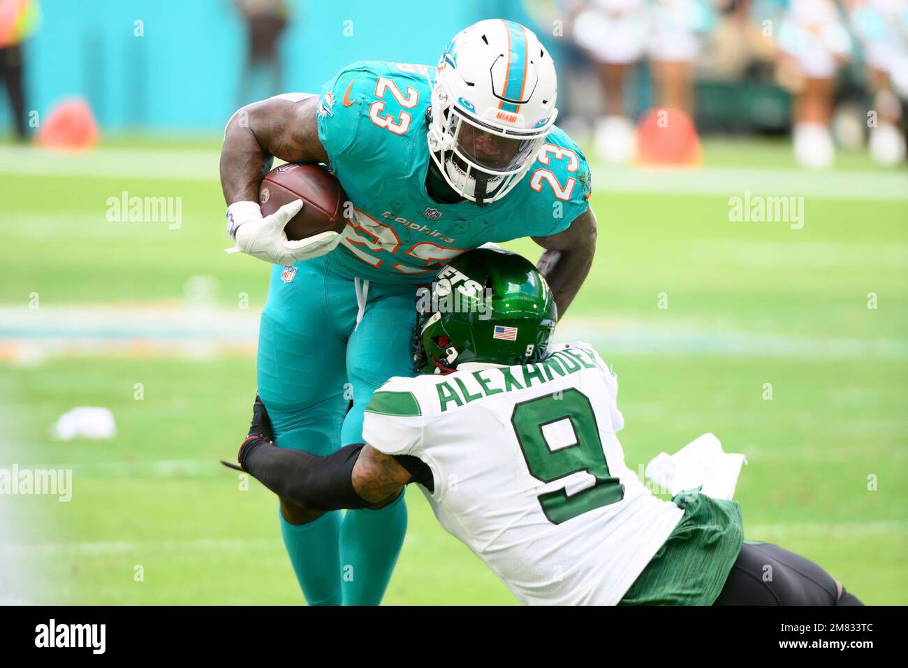 Miami Dolphins running back Jeff Wilson Jr. (23) runs with the ball and ...