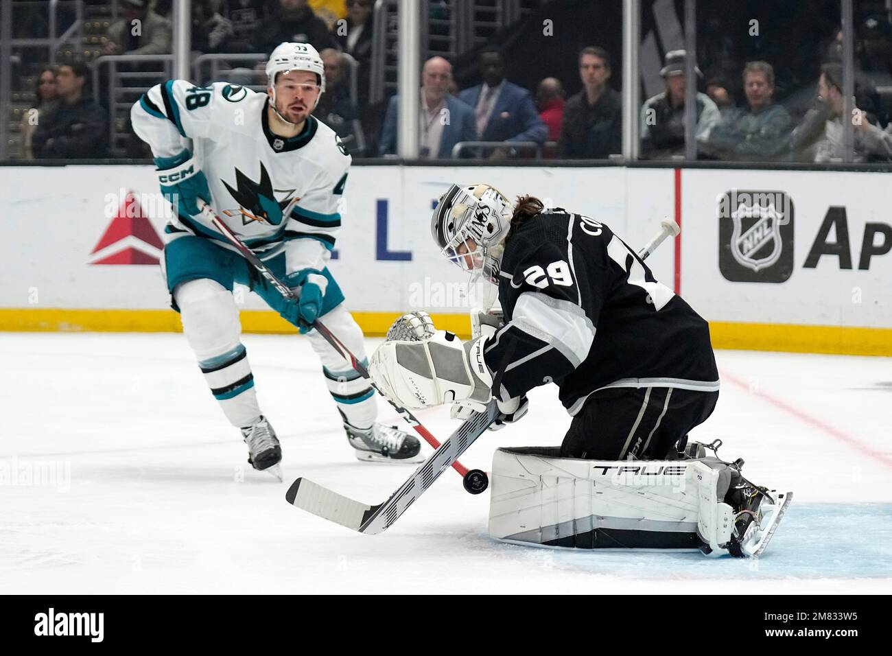 Los Angeles Kings goaltender Pheonix Copley, right, stops a shot by San ...