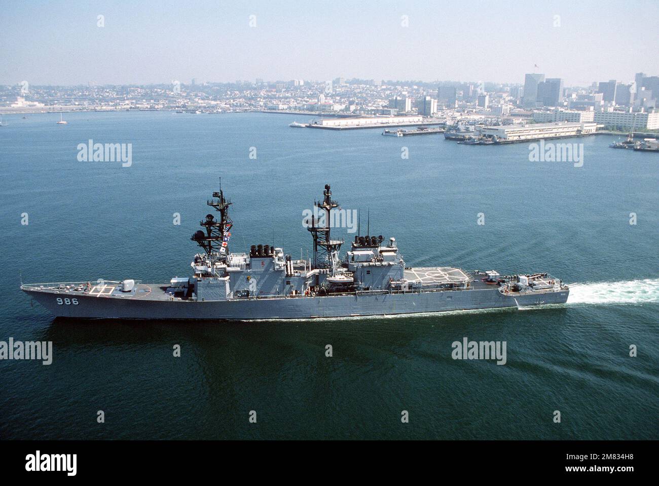 A port beam view of the destroyer USS HARRY W. HILL (DD-986) underway ...