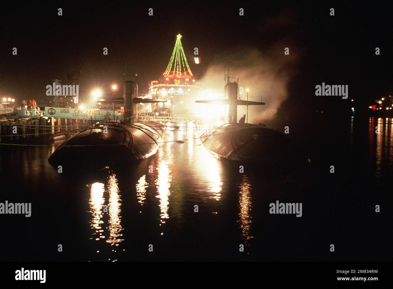 Christmas lights are used to decorate ships that are in port for ...