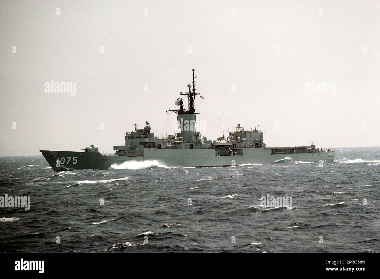 A port view of the frigate USS TRIPPE (FF-1075) underway. Country ...