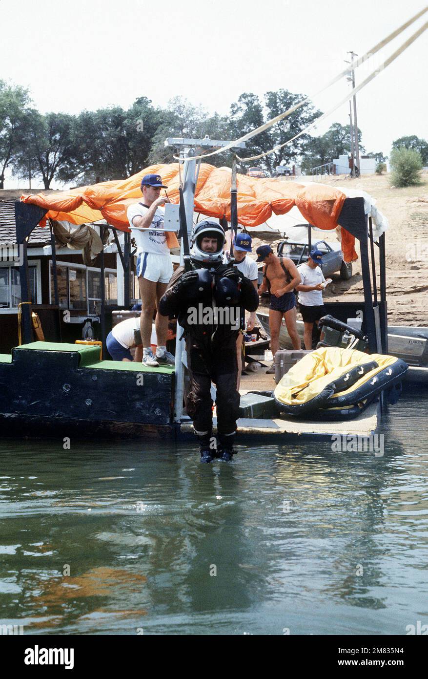 An SR-71 aircraft pilot undergoes water survival training while wearing ...