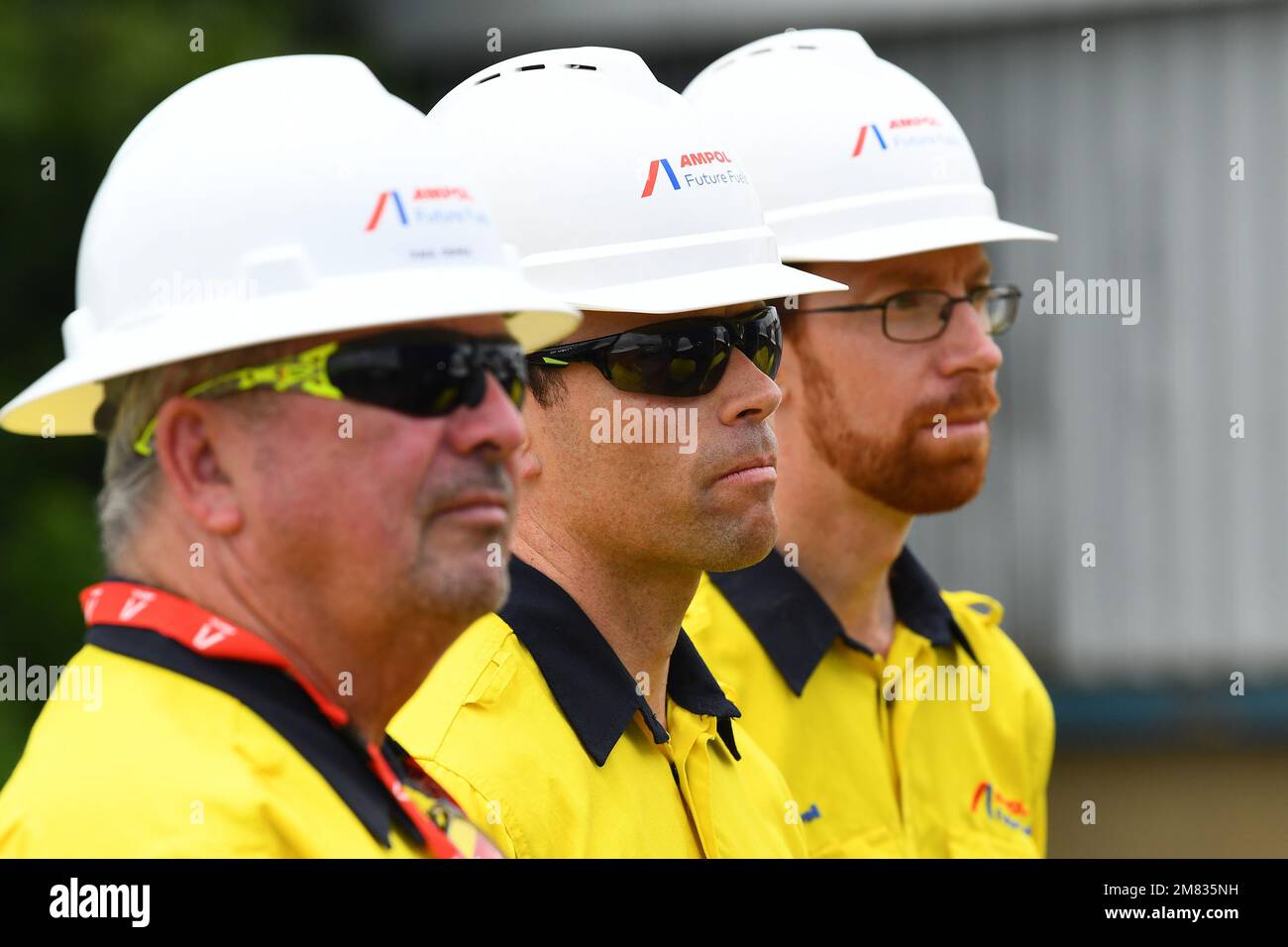 AMPOL employees look on as Acting Queensland Premier Steven Miles ...