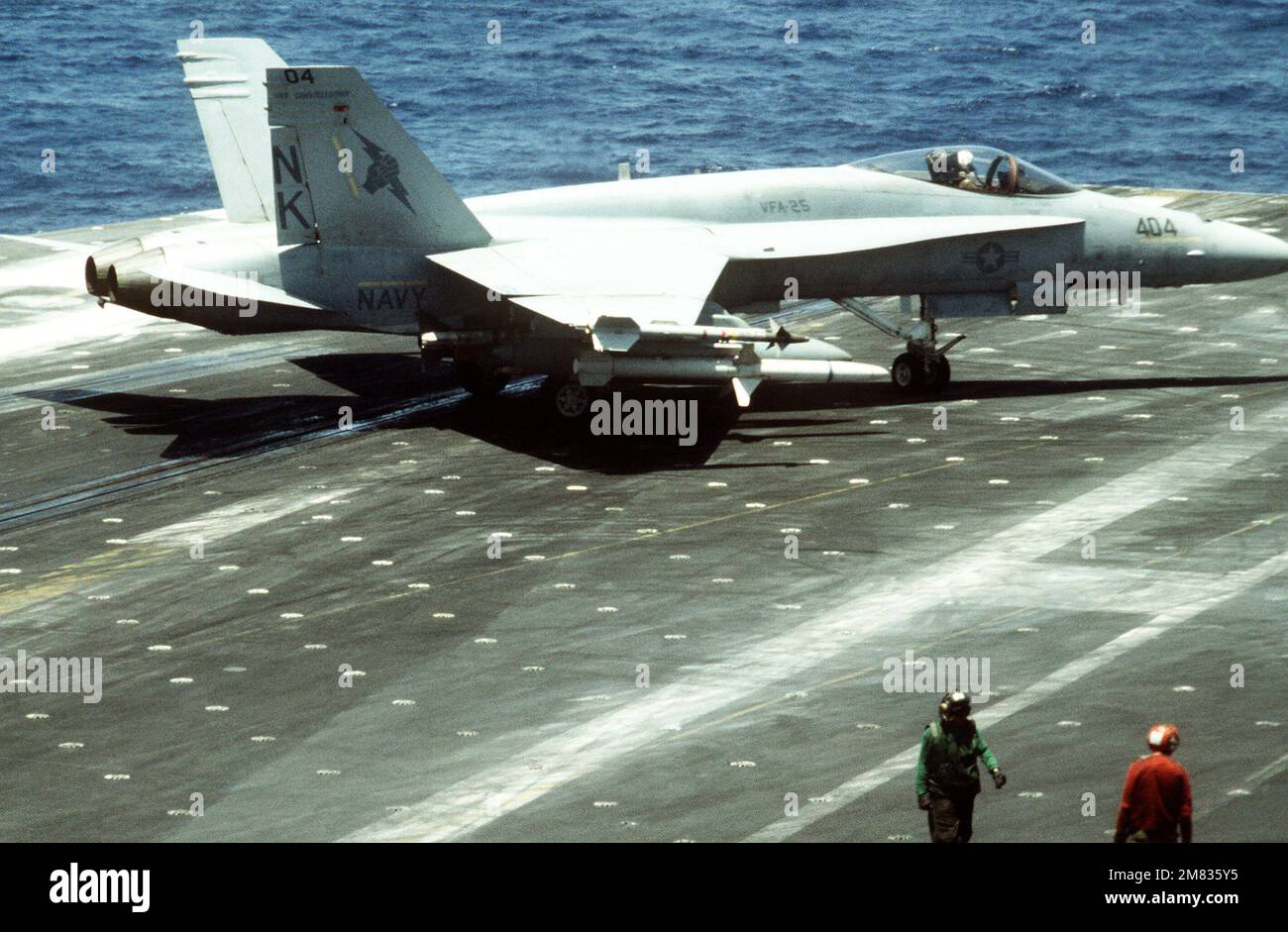 An F/A-18A Hornet aircraft from Strike Fighter Squadron 25 taxis on the ...
