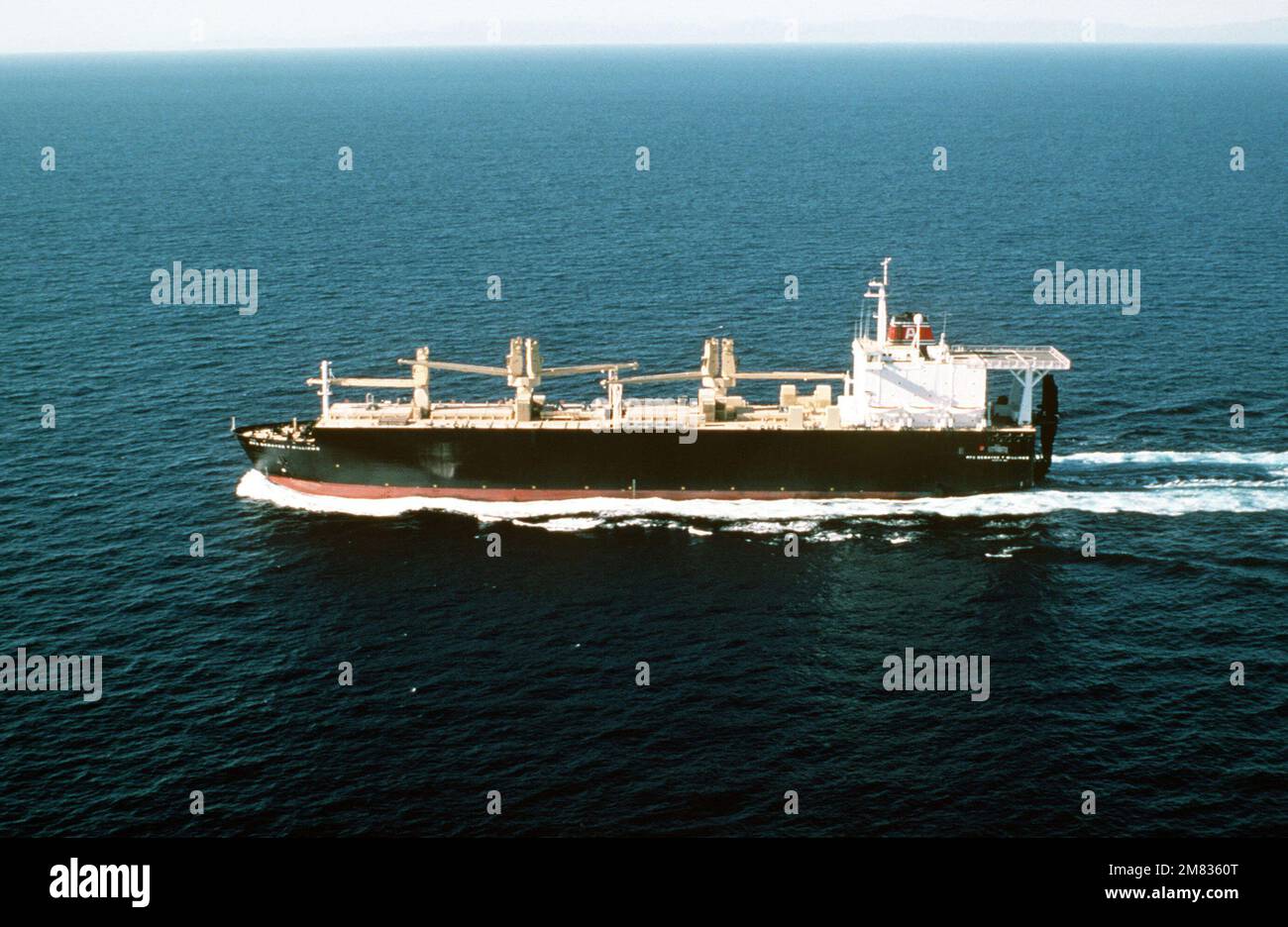 Aerial port beam view of the maritime prepositioning ship USNS PFC ...