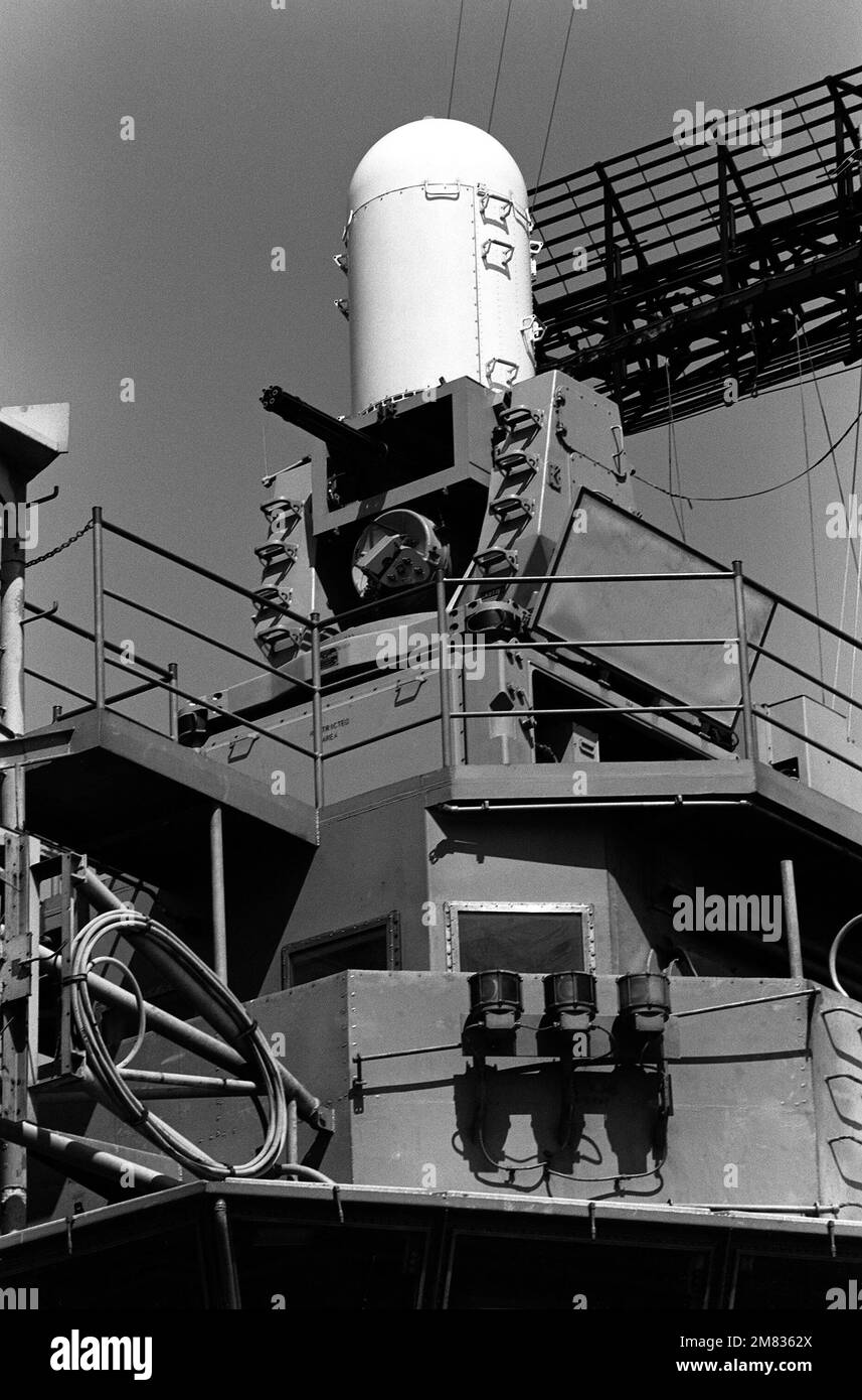 A Mark-16 Phalanx close-in weapon system mounted on the island of the ...