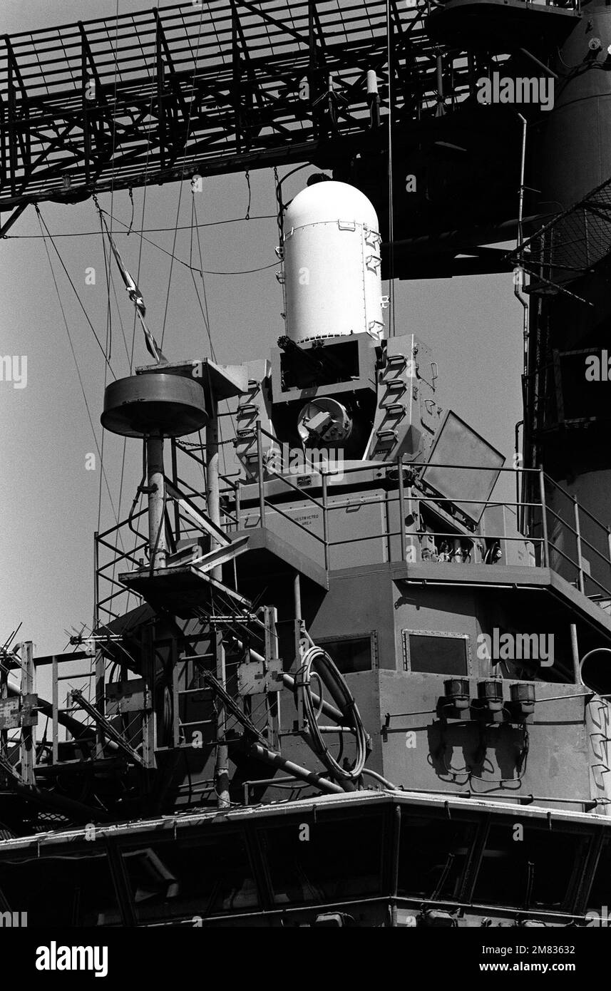 A Mark-16 Phalanx close-in weapon system mounted on the island of the ...