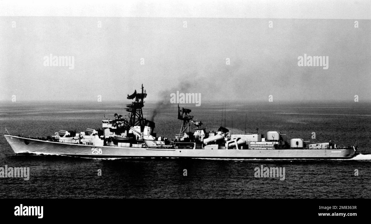 An aerial port beam view of the Soviet destroyer NEULOVIMY underway ...
