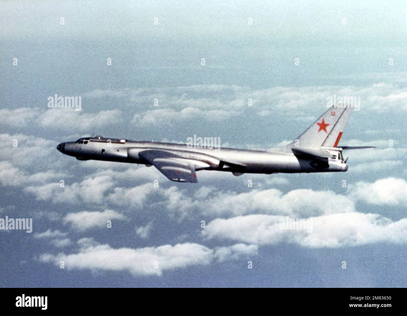 Air-to-air left side view of a Soviet Tu-16 Badger E aircraft. Country ...